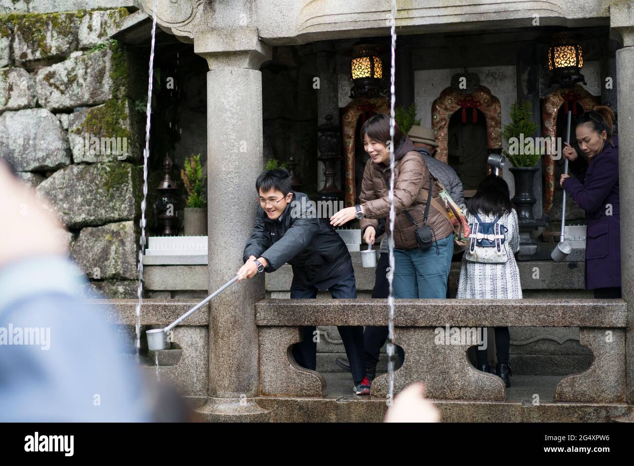 People collecting spring water at a Japanese temple in Kyoto, Japanj ...