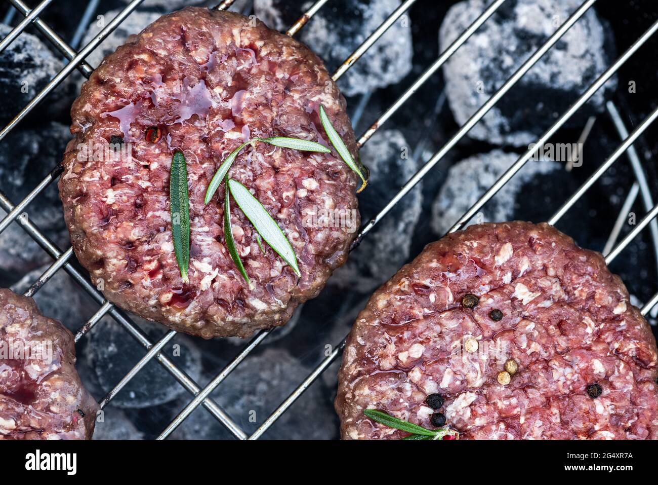 Grilling BBQ Beef Meat Burgers on Charcoal Grill in Backyard Garden ...