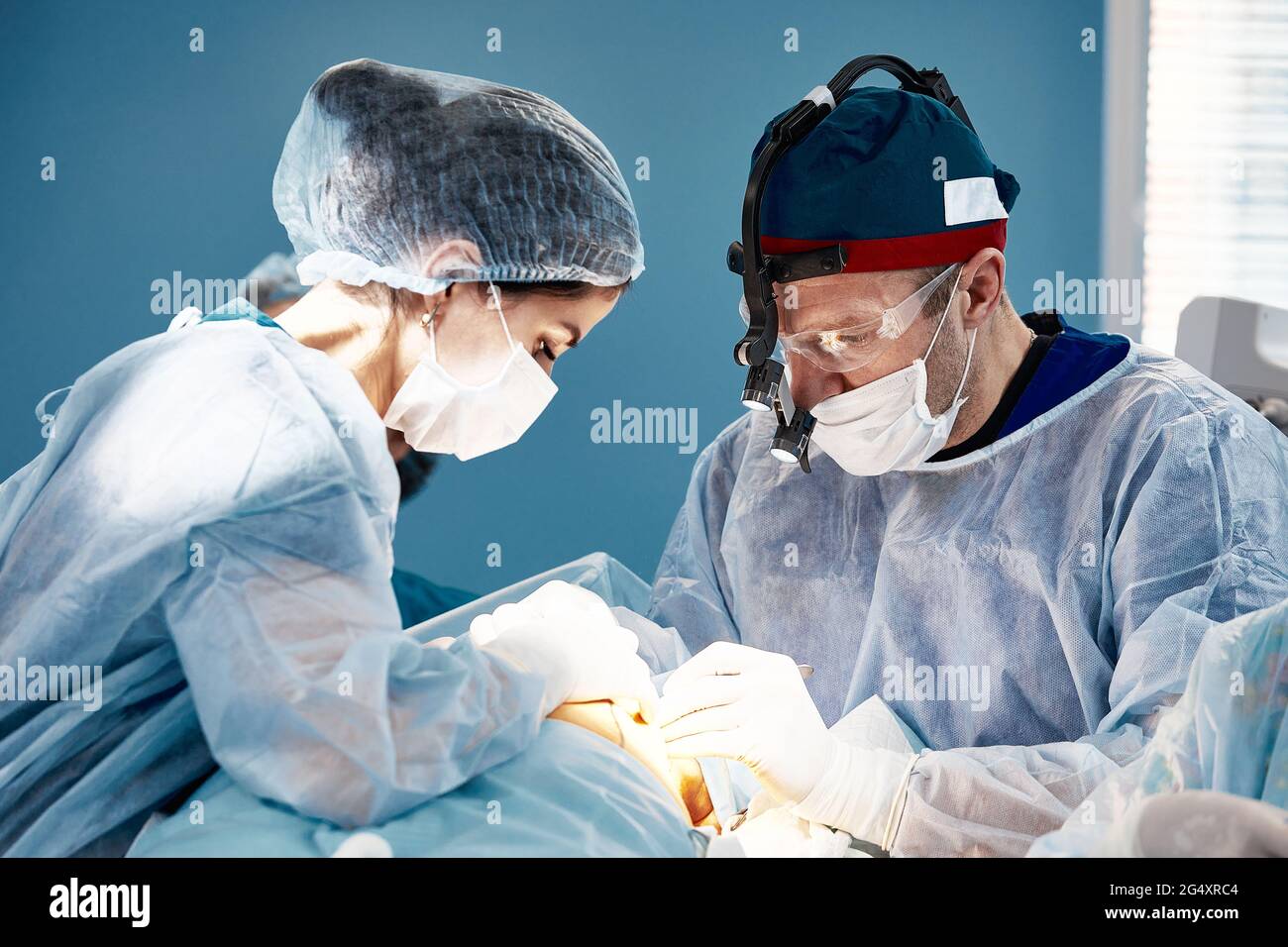 Doctors in hard work during a complex operation in the opera block ...