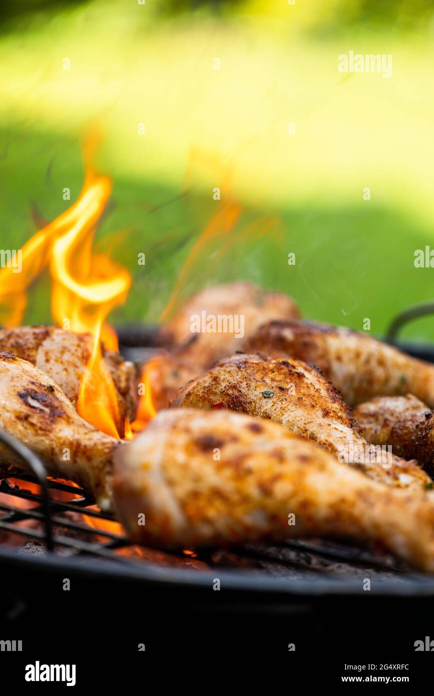 Fire Flames on Charcoal BBQ Grill. Barbeque Food in Backyard Garden at ...