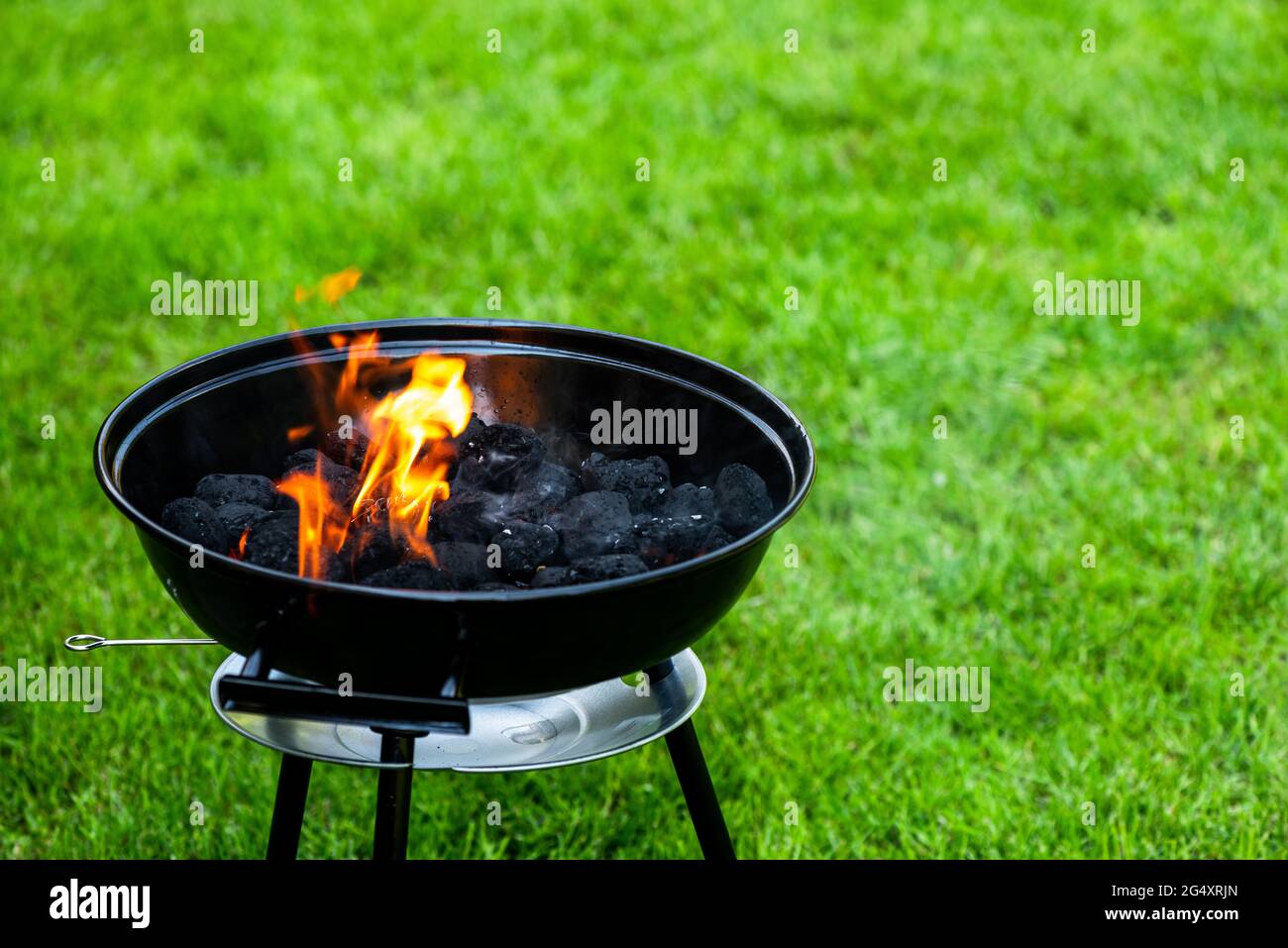 Fire Flames on Grill. Barbeque in Backyard Garden Stock Photo - Alamy