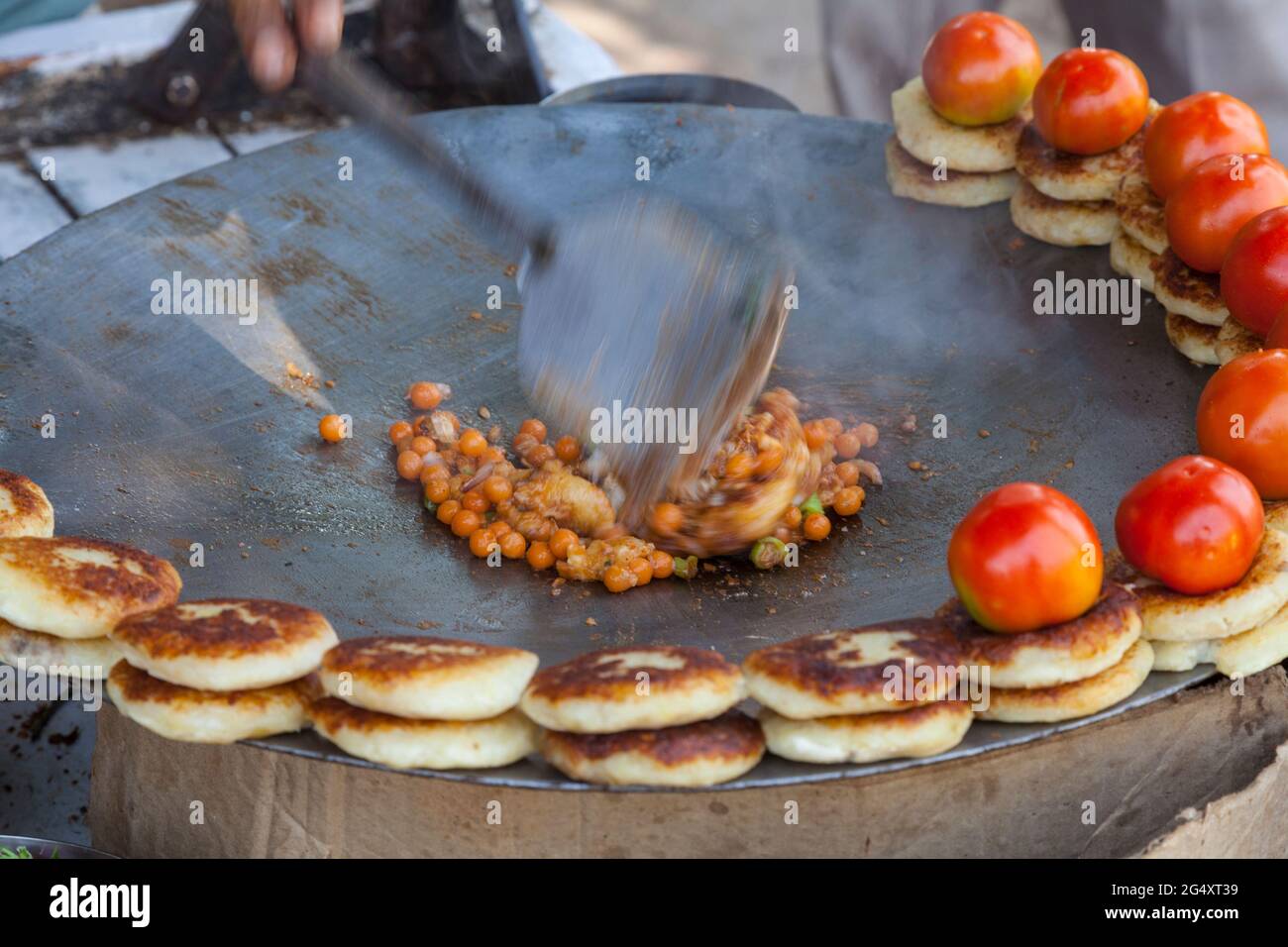 Aloo Tikki Chole (potato patties with chickpea curry), a popular Indian ...