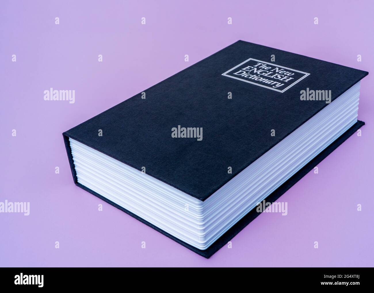 Big black book english dictionary on violet isolated background with ...