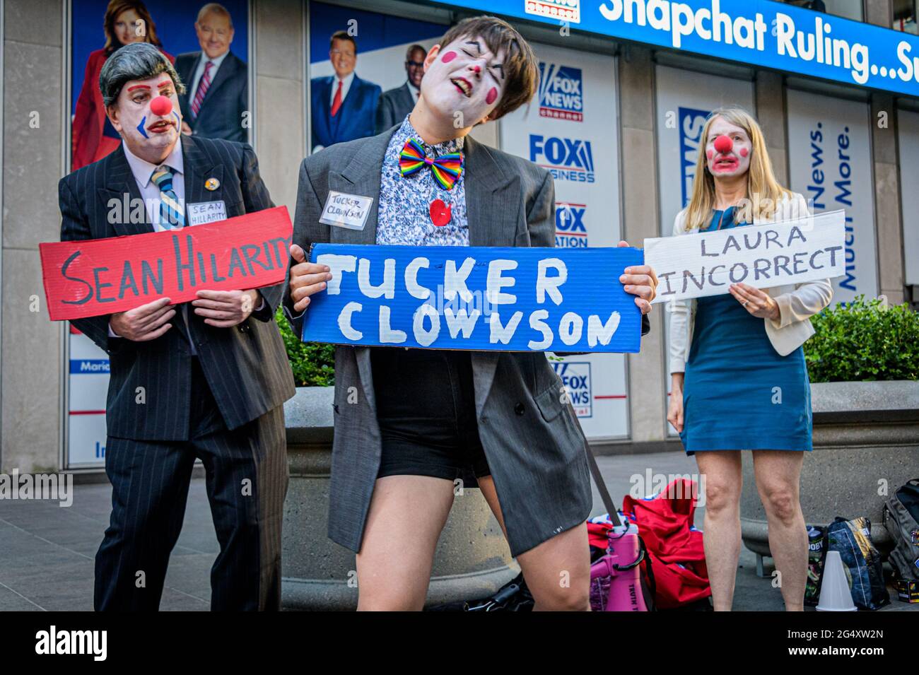 USA. 23rd June, 2021. A group of activists dressed as clowns held a ...