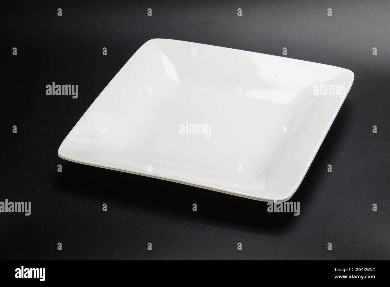 White empty plate for serving isolated Stock Photo - Alamy