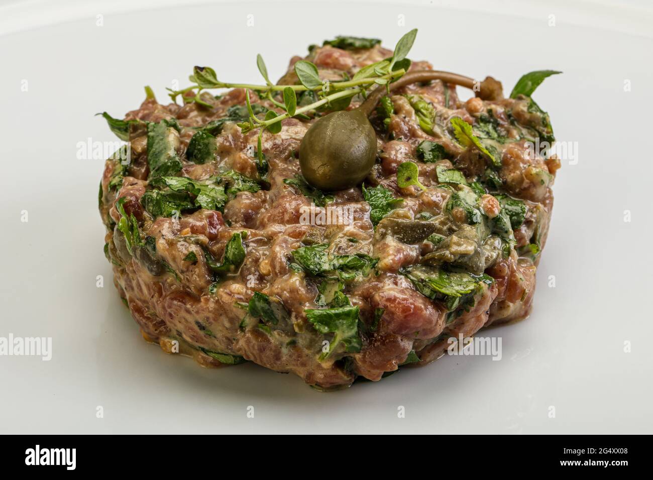 Raw beef tartar snack with capers Stock Photo - Alamy