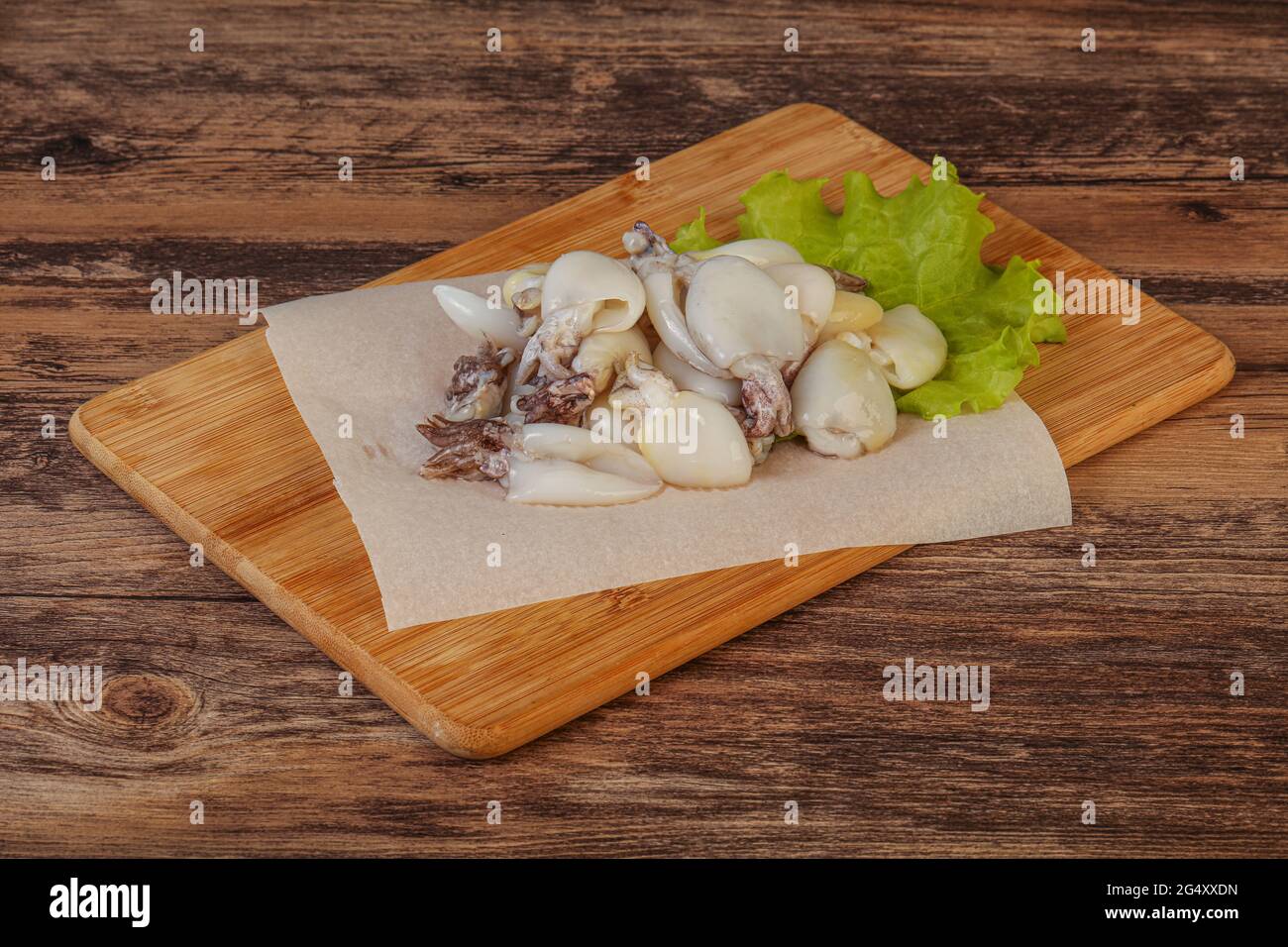 Raw seafood - cuttlefish for cooking over board Stock Photo - Alamy