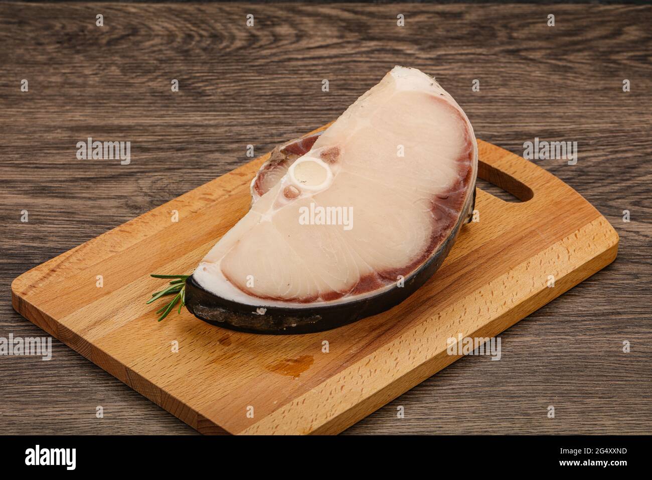 Raw shark steak served rosemary for cooking Stock Photo - Alamy