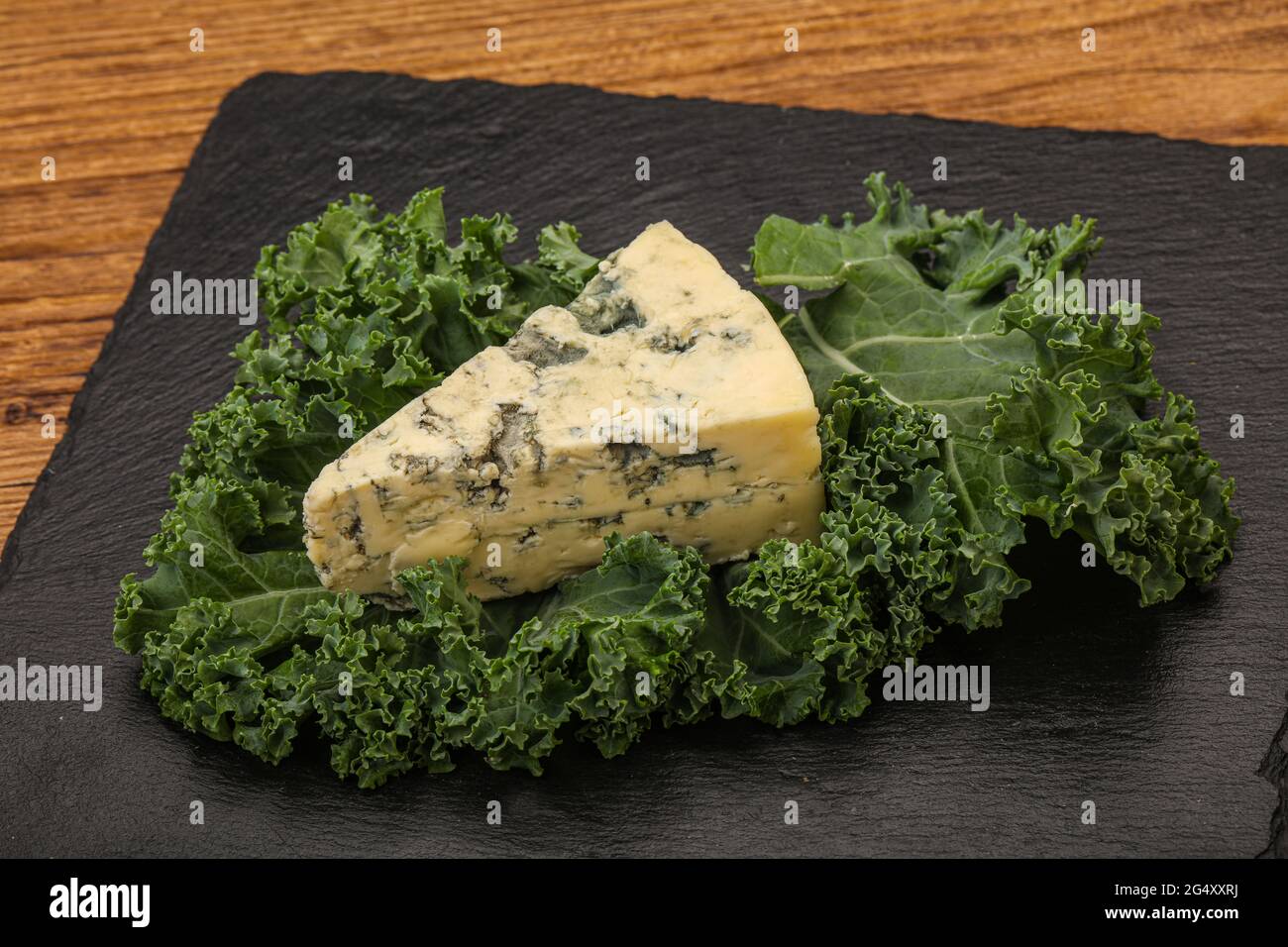 Dairy Blue cheese triangle with mold Stock Photo - Alamy