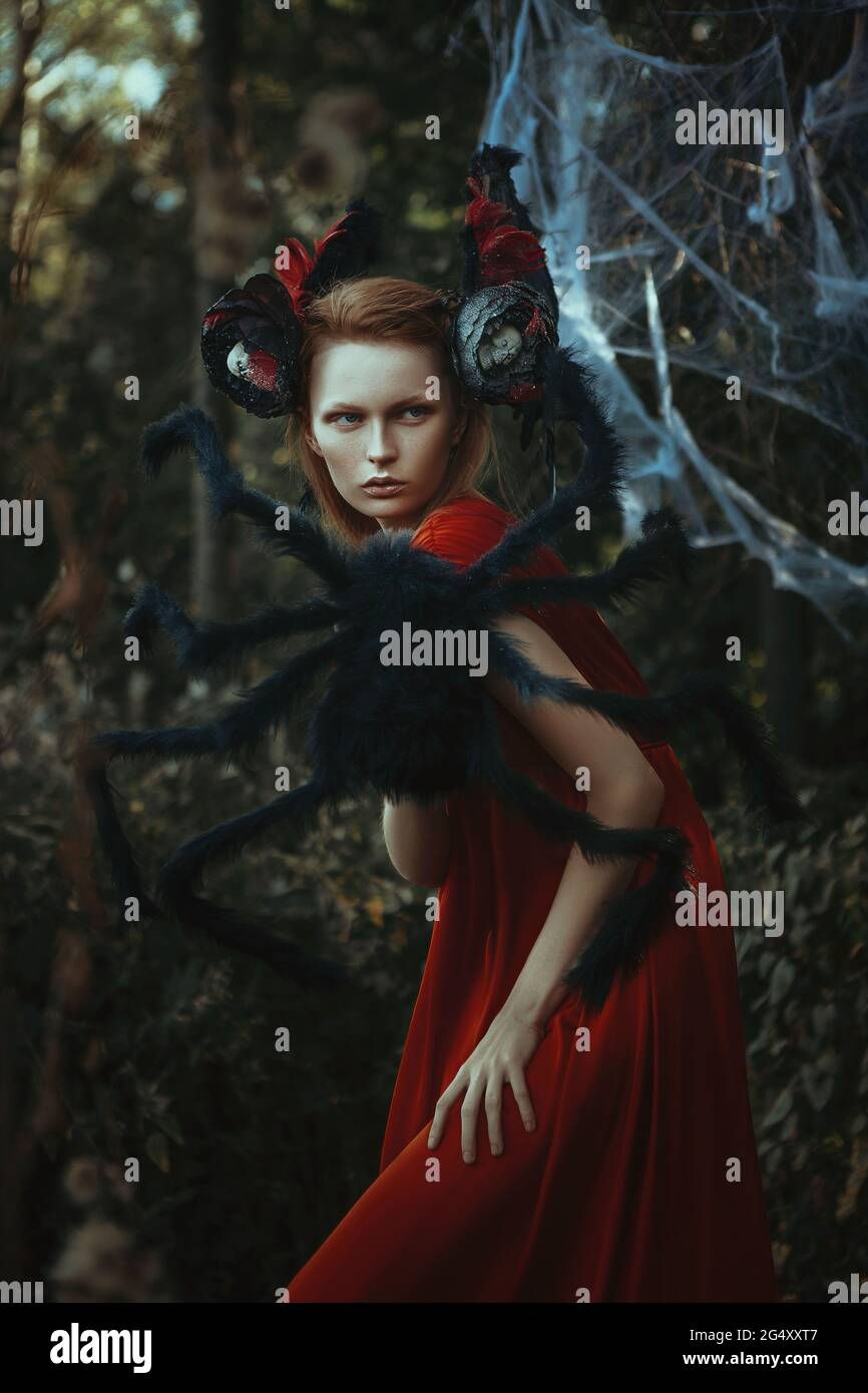 The young model is posing as a fairy in a spiderweb Stock Photo - Alamy