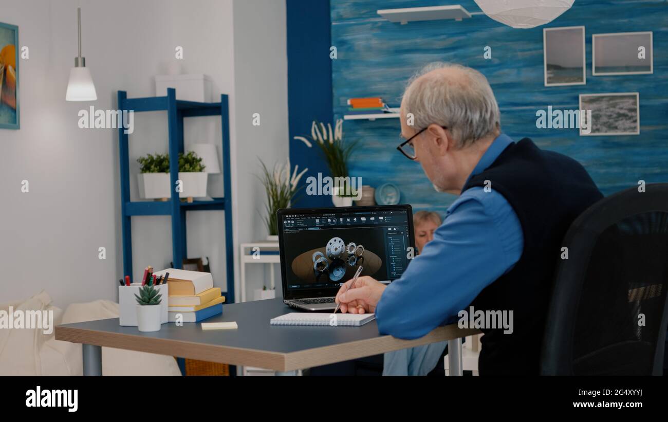 Senior remote man architect working on modern cad program analysing ...