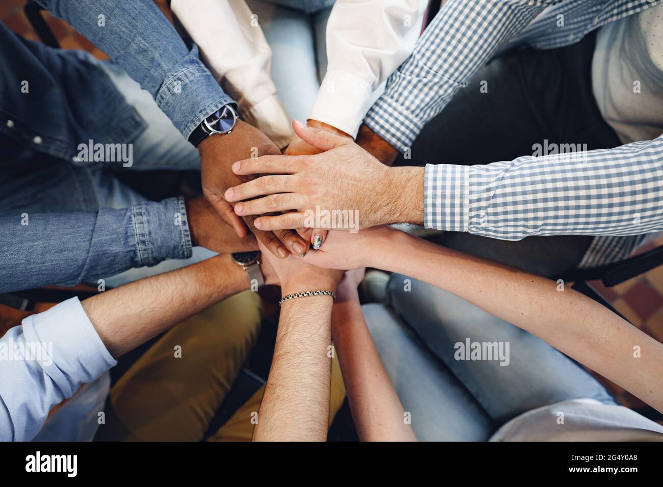 Top view of diverse people hands holding together in circle, hands ...