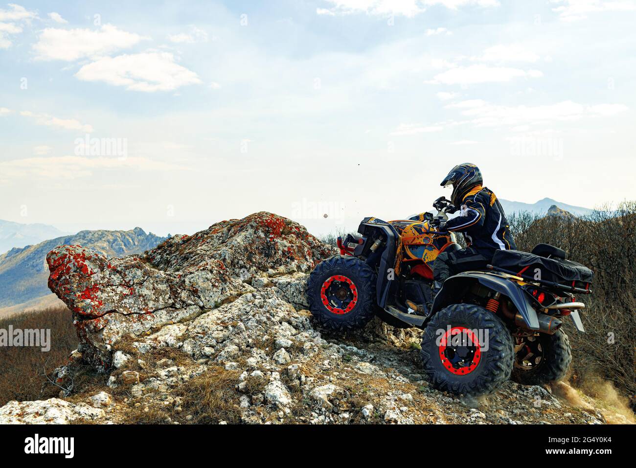 Man on quad with helmet hi-res stock photography and images - Alamy