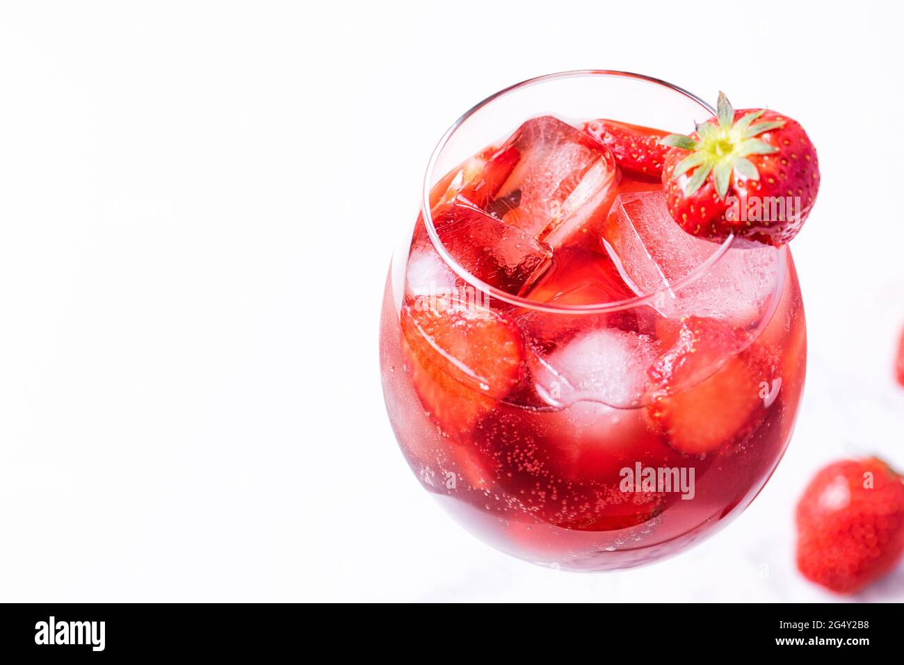 Wine glass of strawberry alcohol aperol or daiquiri cocktail. Homemade ...