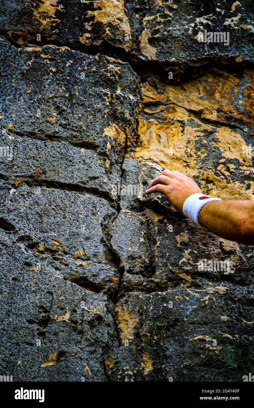 climbing. hand of climber grabs the rock. vertical format Stock Photo ...