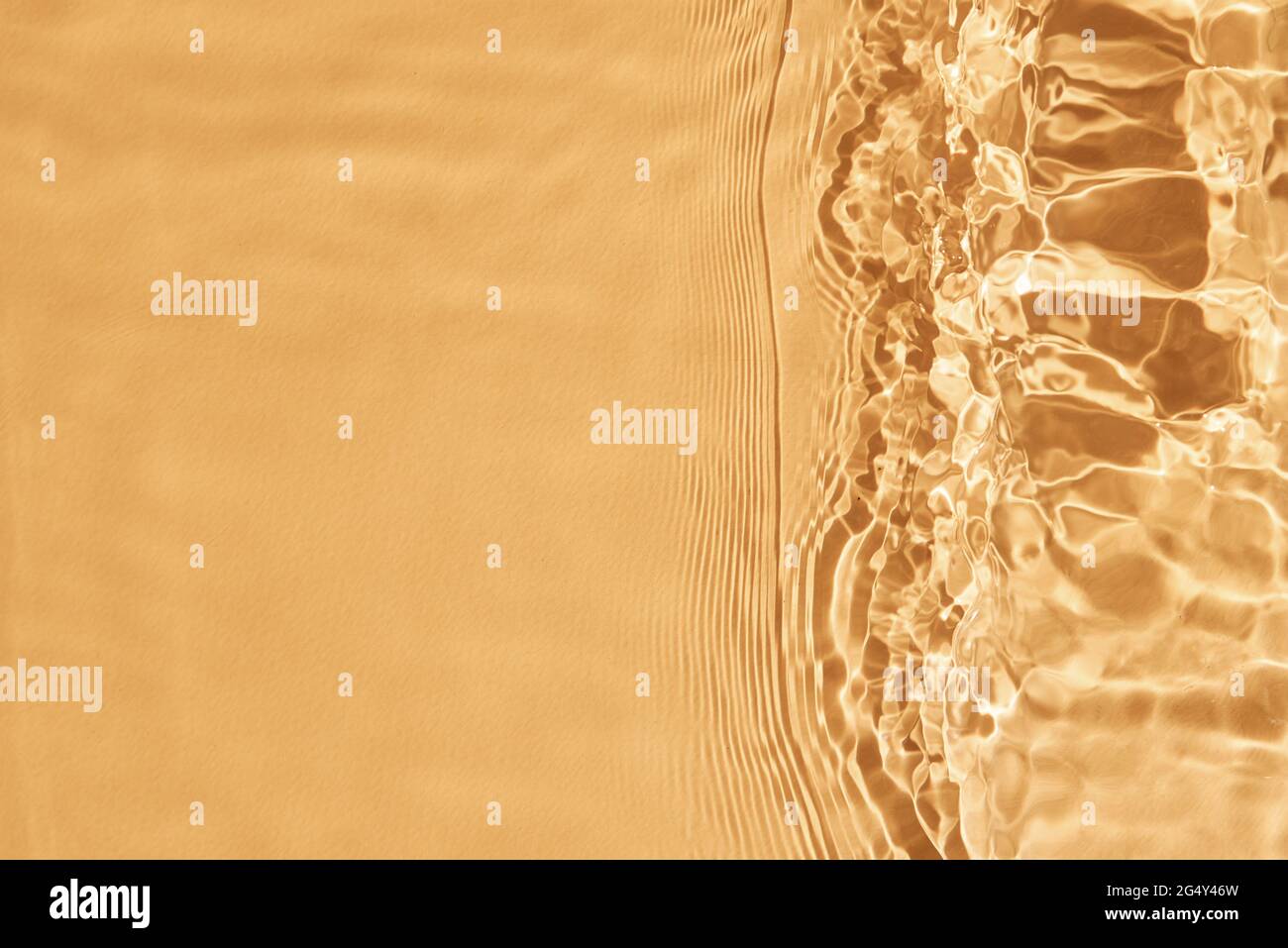 Yellow water surface background. Water texture with reflections ...