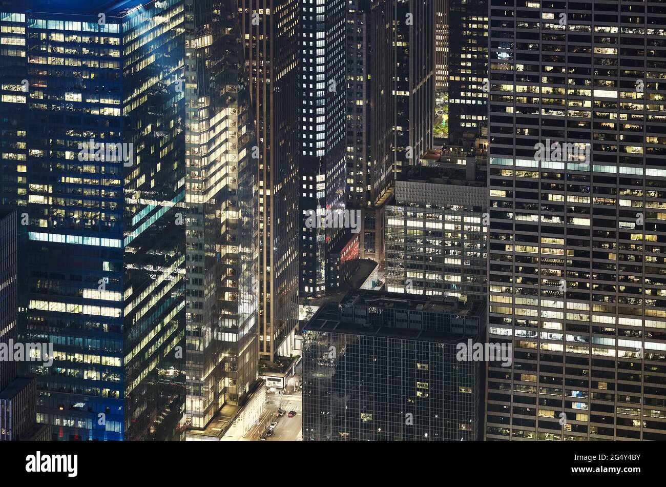 Aerial view of office buildings in Manhattan at night, New York City ...