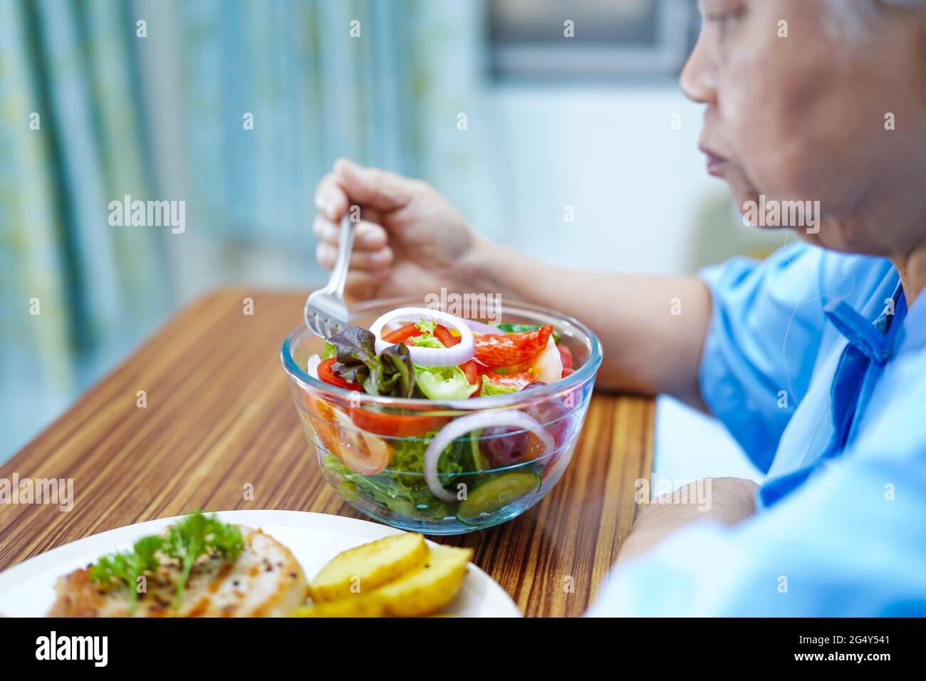 Asian senior or elderly old lady woman patient eating breakfast ...