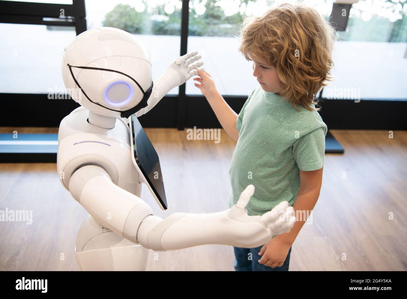 robotic pandemic future. robot communicate with child. automation ...