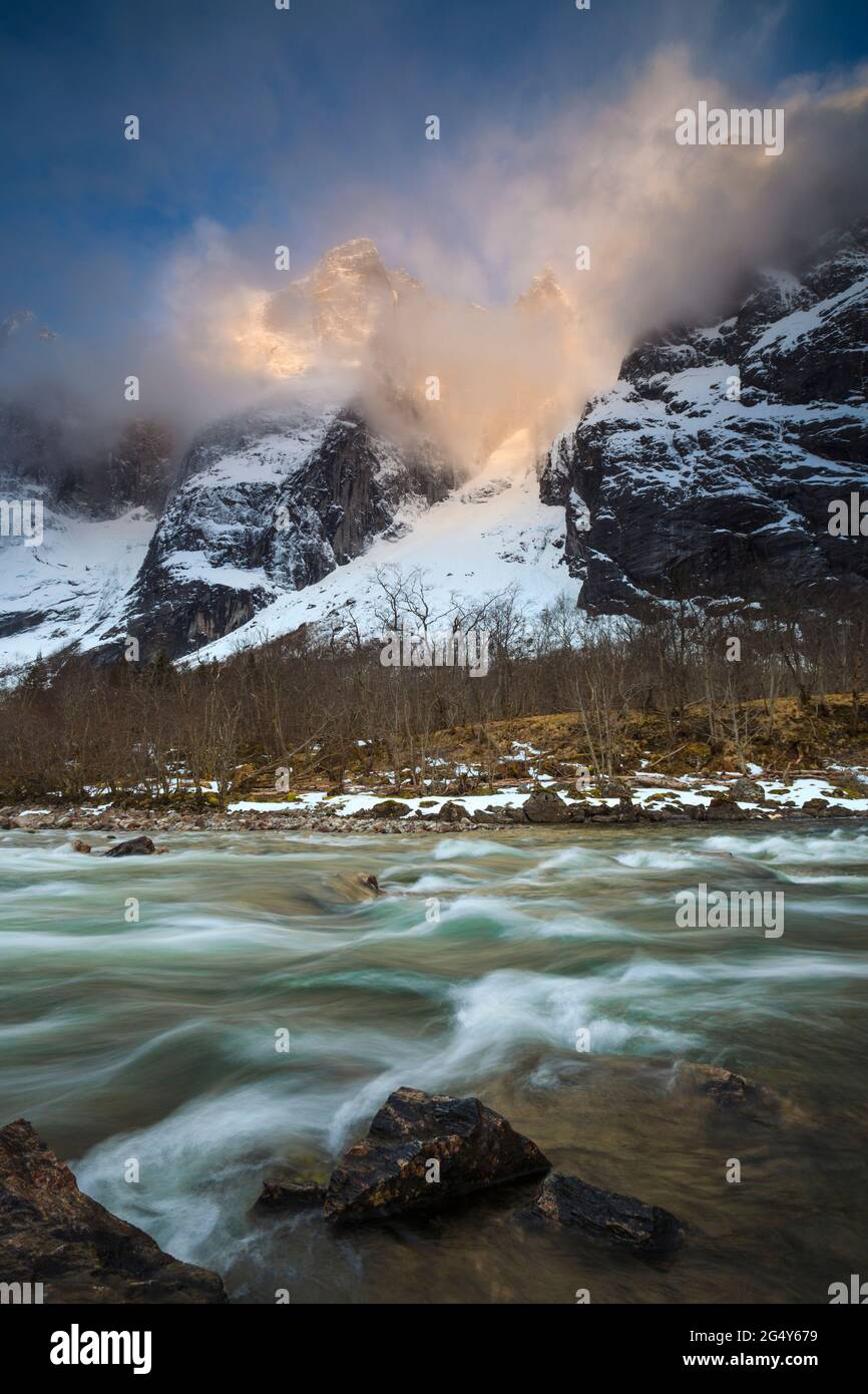 Early morning sunlight and mist around Trollveggen, or the Troll Wall ...