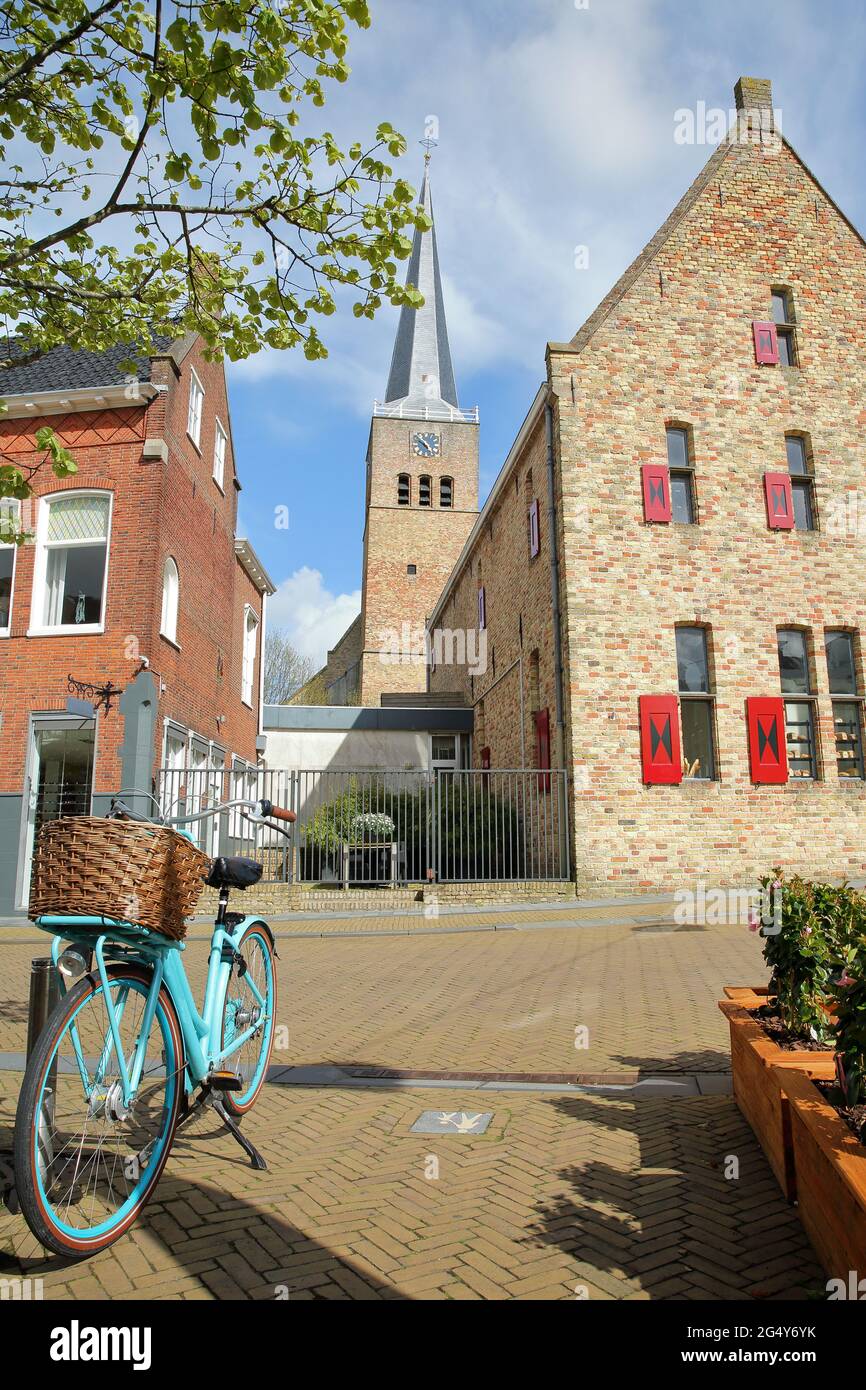 Medieval buildings and the clock tower of Martinikerk (St Martin church ...