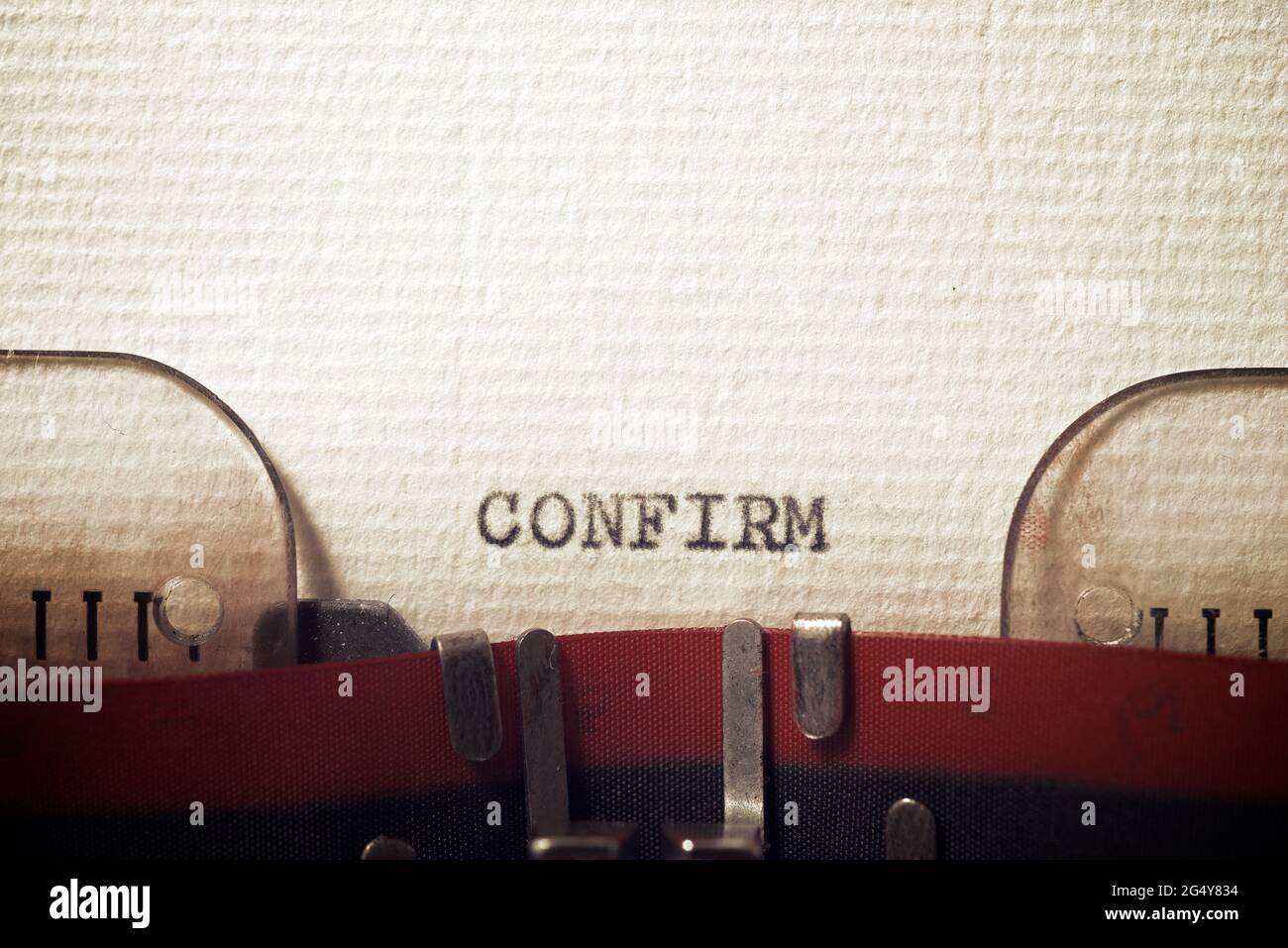 The word confirm written with a typewriter Stock Photo - Alamy