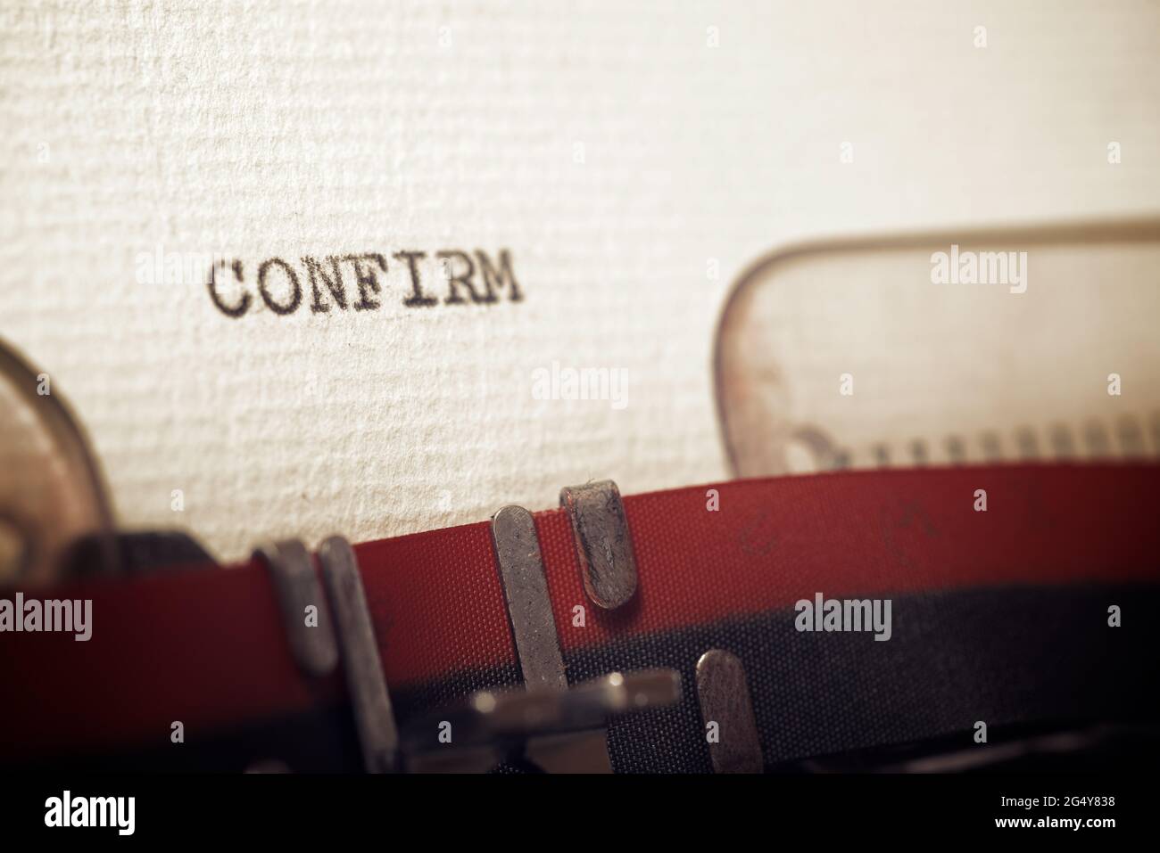 The word confirm written with a typewriter Stock Photo - Alamy
