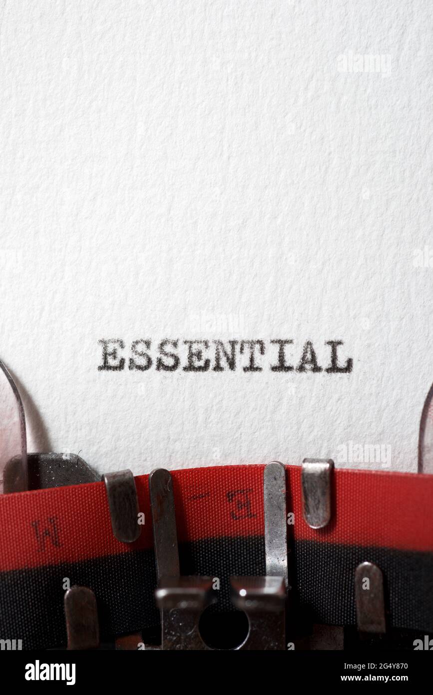 The word essential written with a typewriter Stock Photo - Alamy