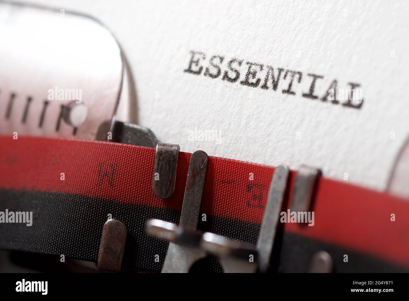 The word essential written with a typewriter Stock Photo - Alamy