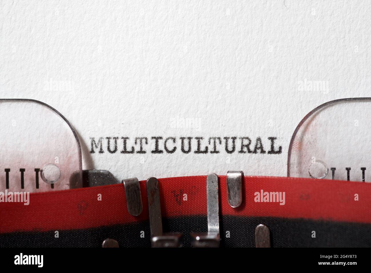 The word multicultural written with a typewriter Stock Photo - Alamy