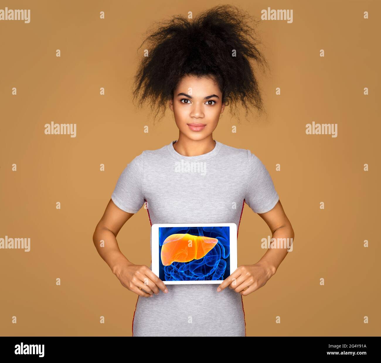 Girl shows the x-ray image of the liver. Photo of young girl with ...