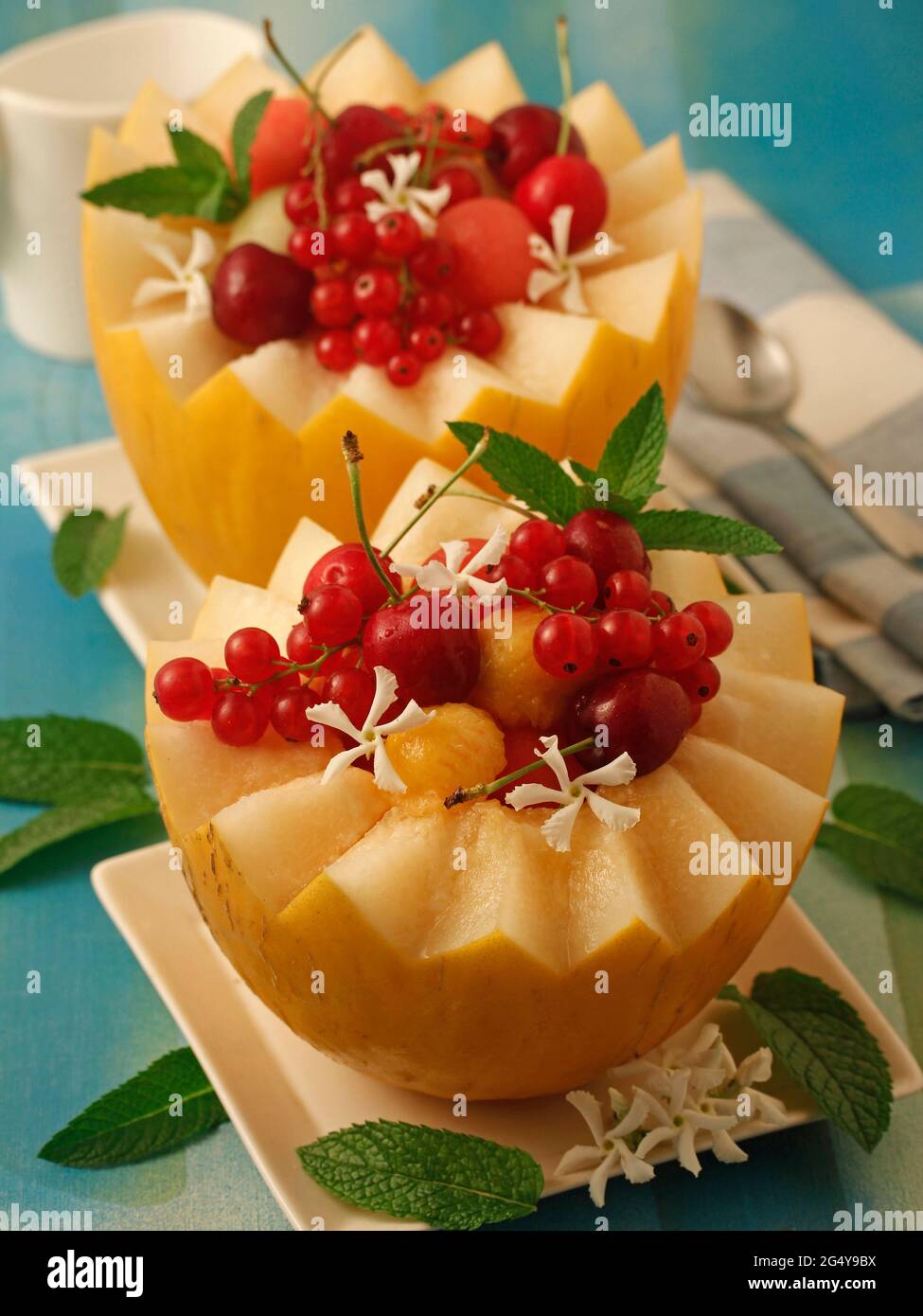 Melon filled with fruit Stock Photo - Alamy