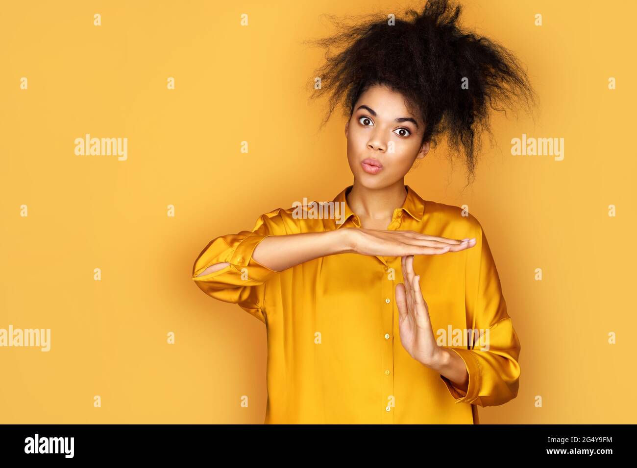 I need break. Girl making a timeout gesture. Photo of african american ...
