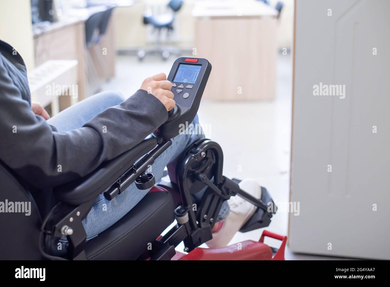Close-up of a female hand on the control handle of an electric ...