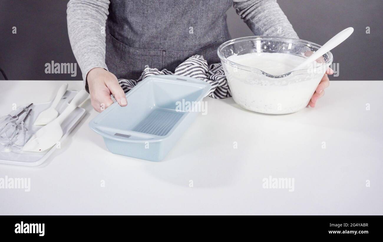 Pouring ice cream mixture into the baking pan to be frozen Stock Photo ...