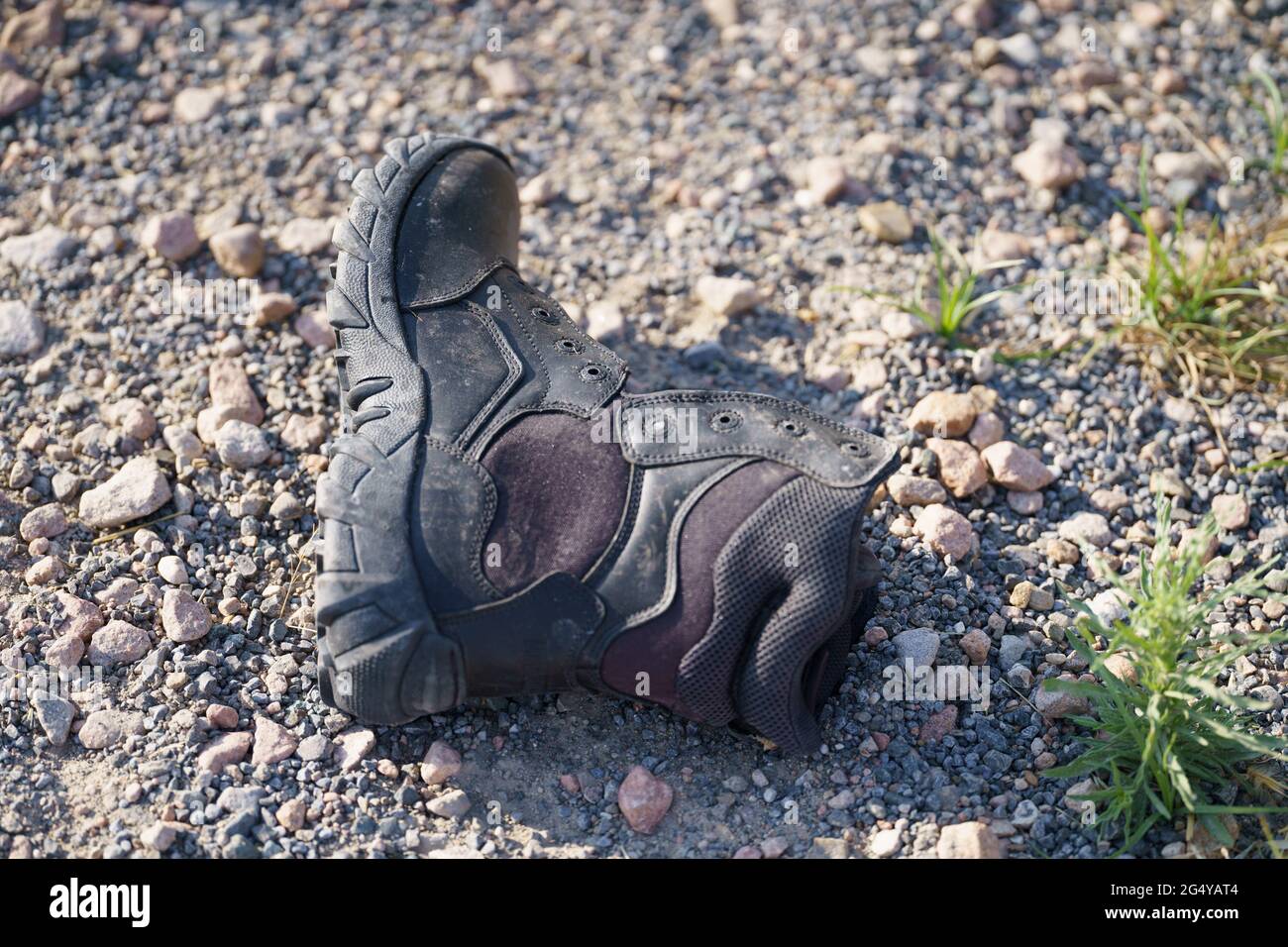 Boot thrown on the ground Stock Photo - Alamy