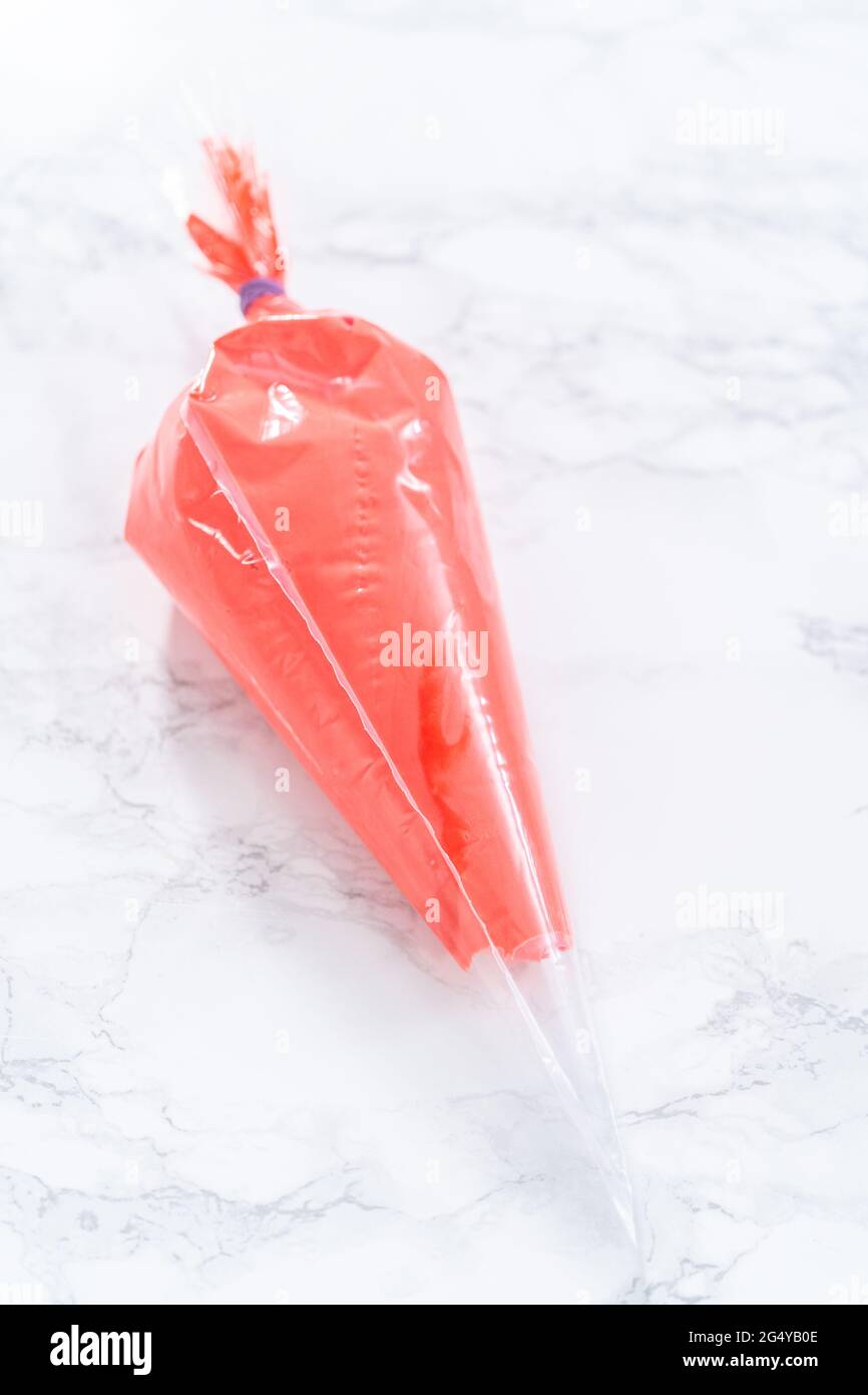 Buttercream frosting in a piping bag for decorating a cake Stock Photo ...