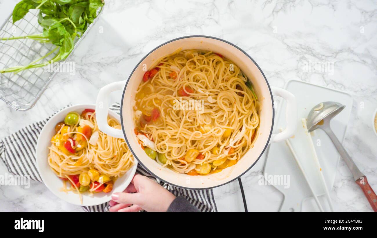 Flat lay. Step by step. Serving a one-pot pasta into a white pasta ...