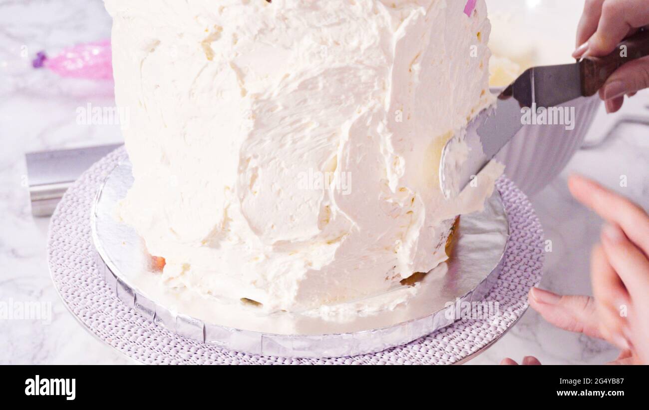 Step by step. Frosting round funfetti cake with white italian ...