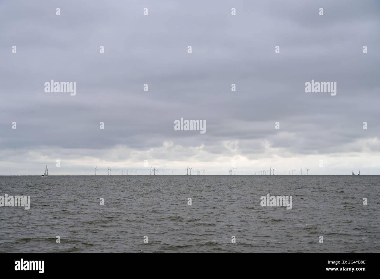 The power of wind: Sailboats and wind turbines harnessing wind at ... The power of wind: Sailboats and wind turbines harnessing wind at ...