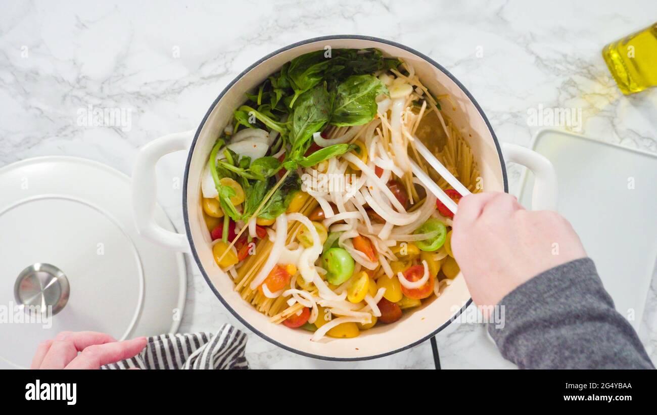Flat lay. Step by step. Cooking on pot pasta recipe in an enameled cast ...