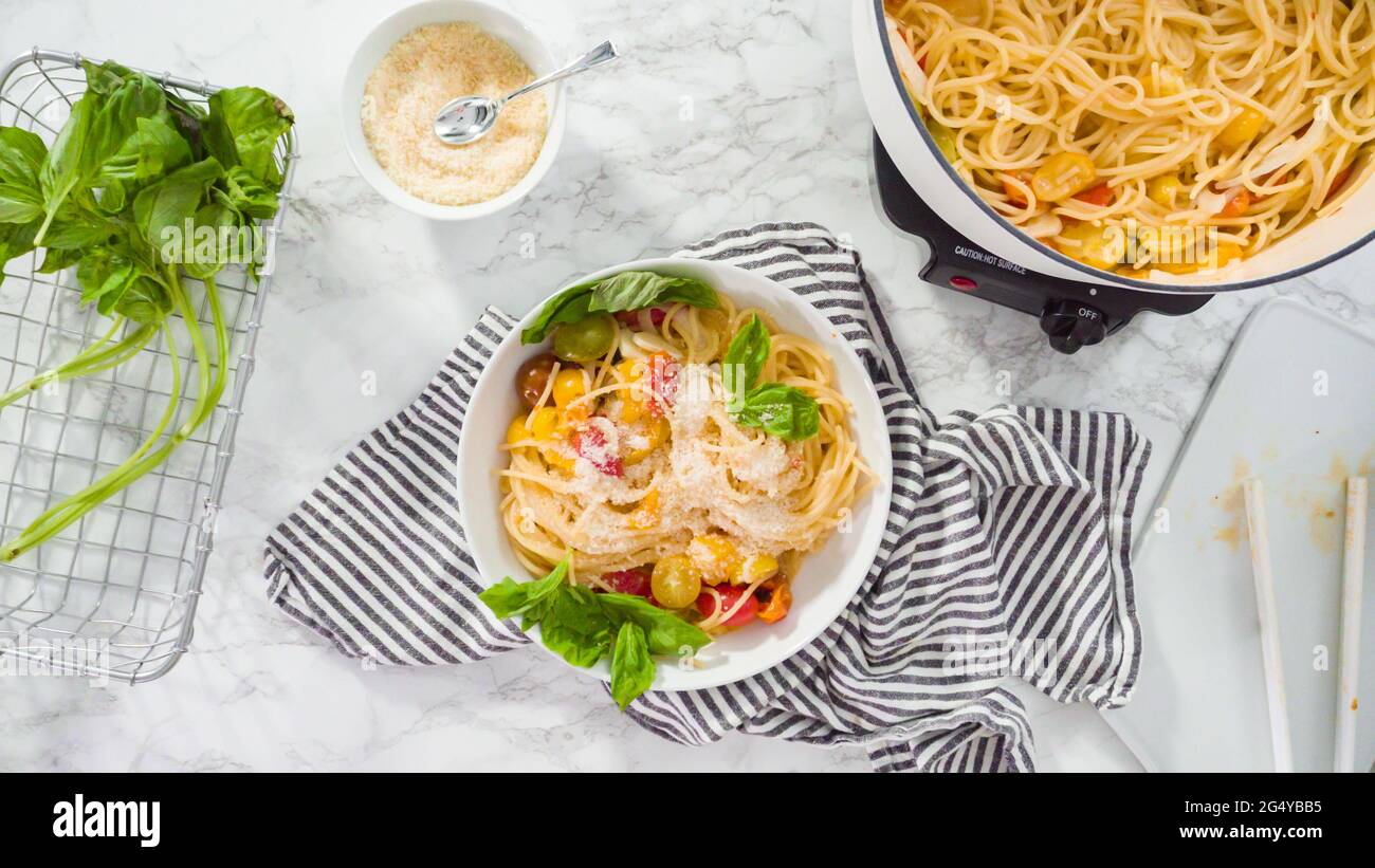 Flat lay. Step by step. Serving a one-pot pasta into a white pasta ...