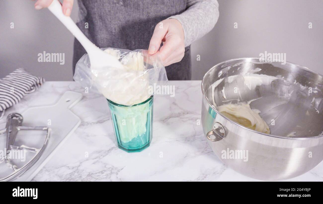 Step by step. Mixing ingredients in a standing kitchen mixer to prepare ...