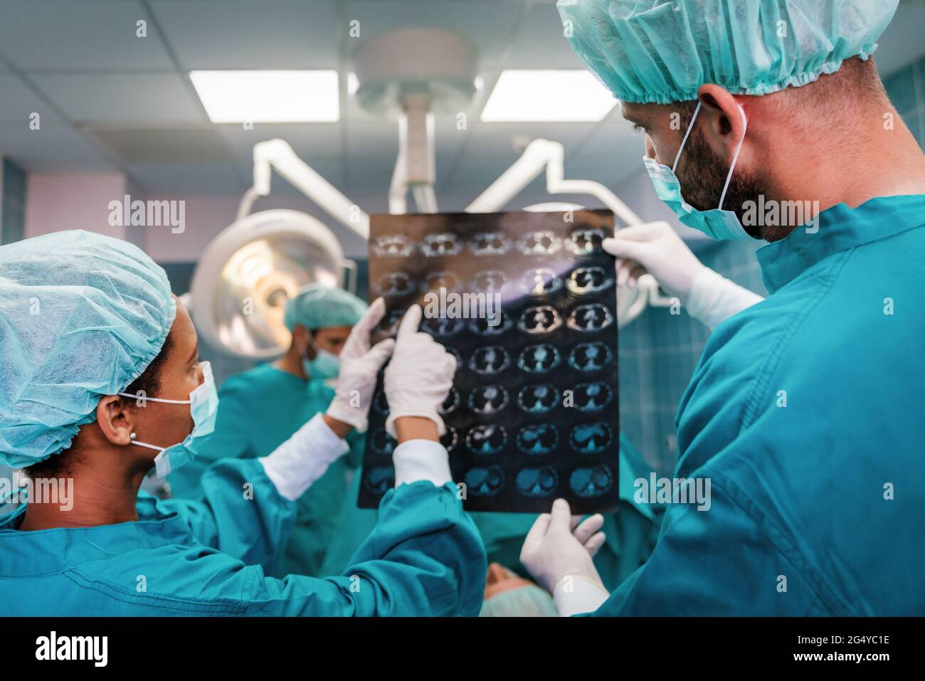 Healthcare and medical concept. Group of doctors looking at x-ray ...