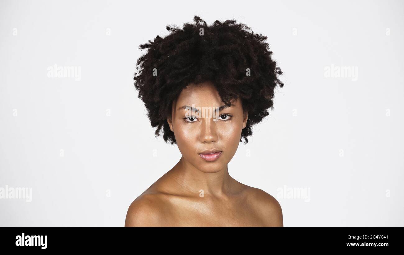 African american woman with perfect skin looking at camera isolated on ...