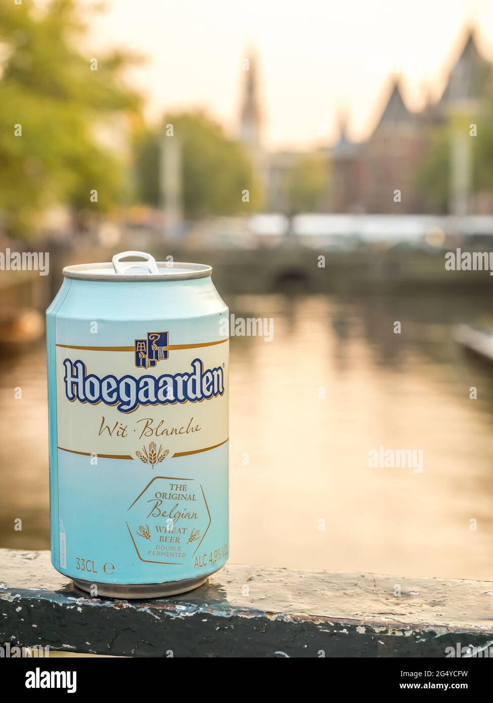 AMSTERDAM - OCTOBER 4: Hoegaarden beer can with blurring city scene ...