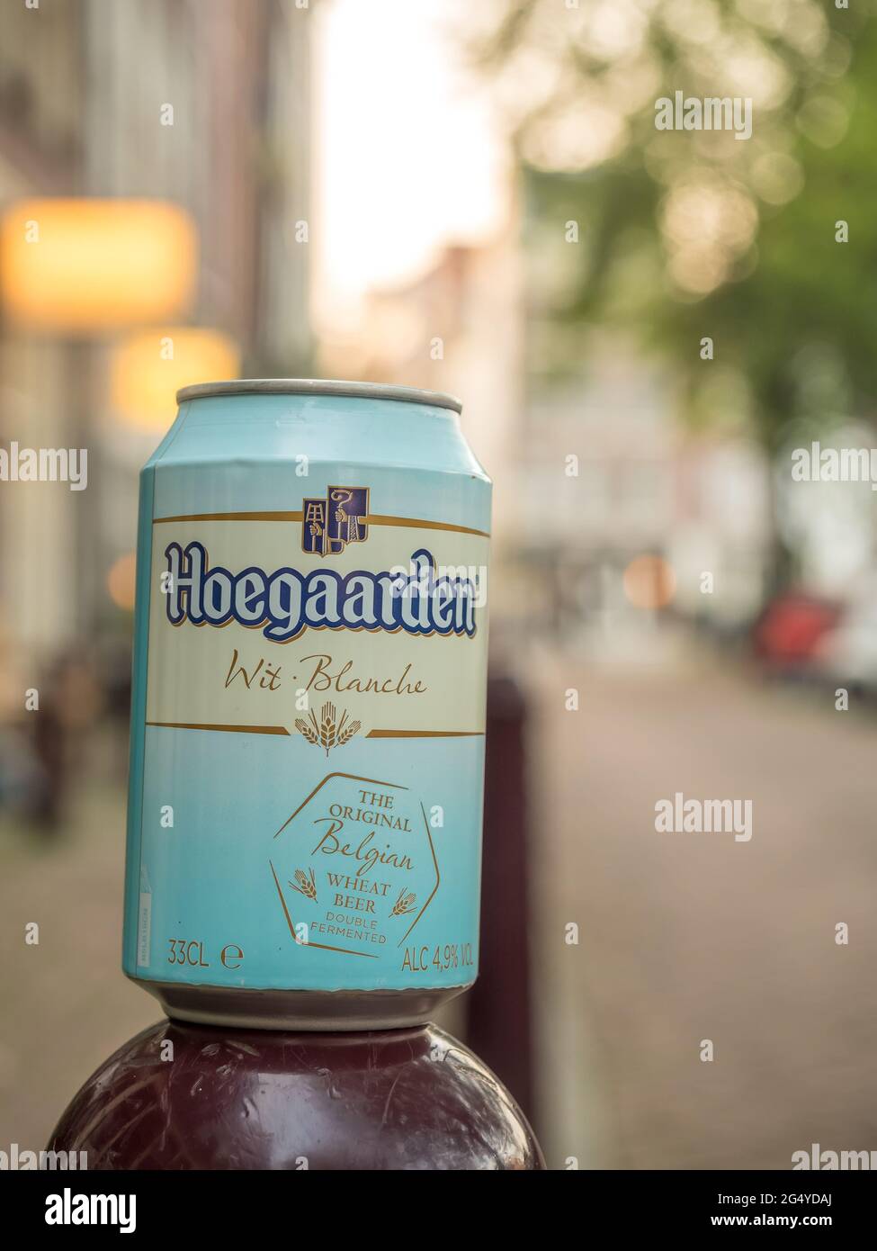 AMSTERDAM - OCTOBER 4: Hoegaarden beer can with blurring city scene ...