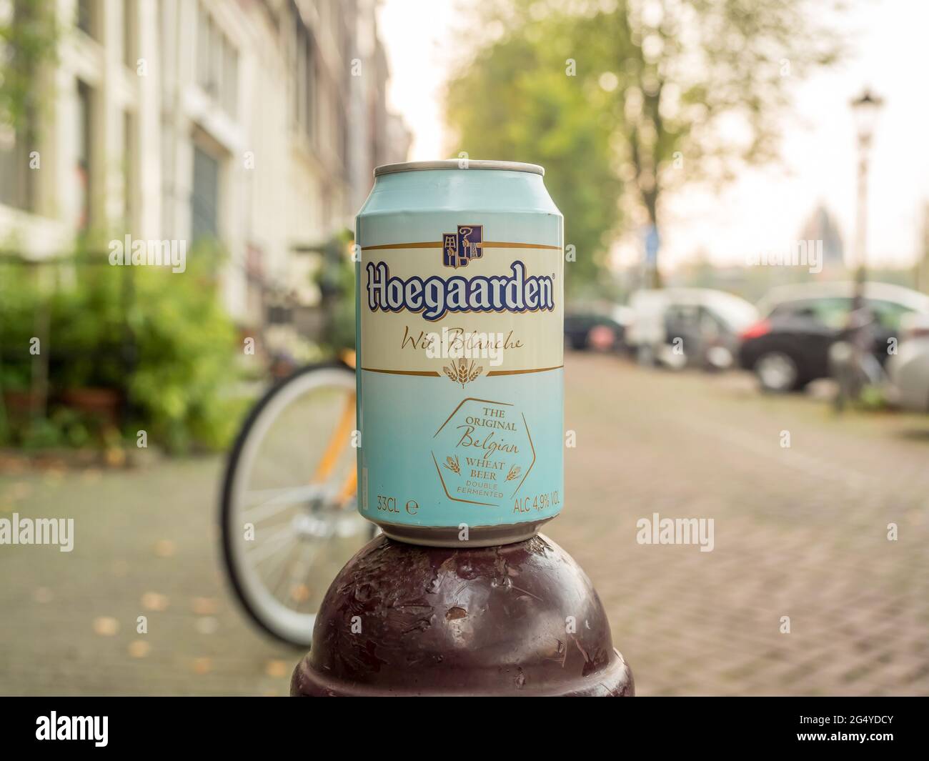 AMSTERDAM - OCTOBER 4: Hoegaarden beer can with blurring city scene ...