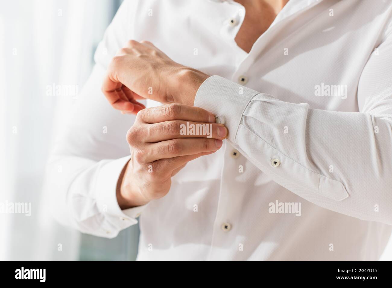 Buttoning cuffs hi-res stock photography and images - Alamy