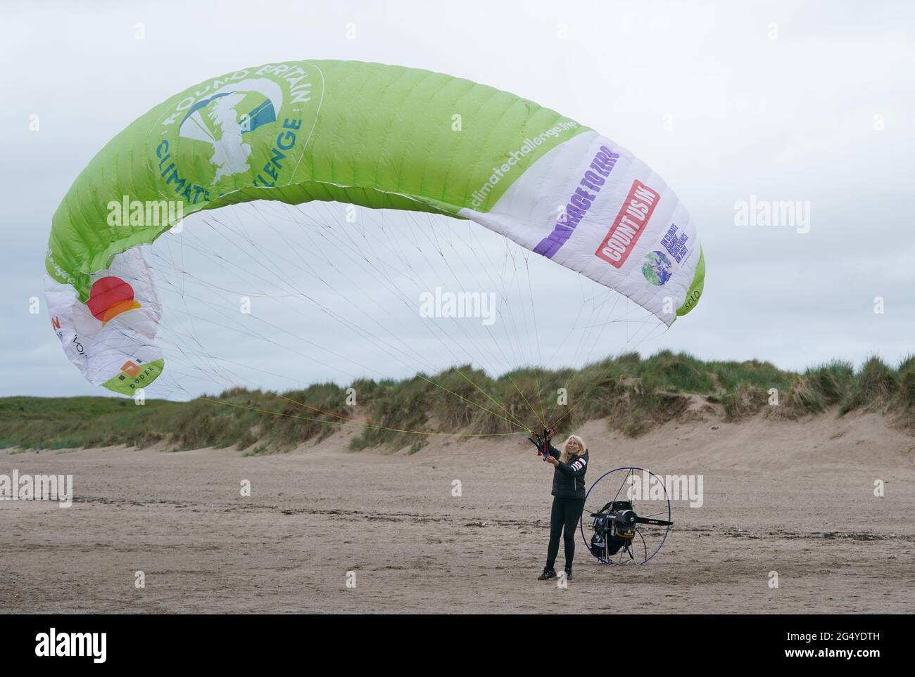 Paramotorist Sacha Dench with her adapted electric paramotor and glider ...